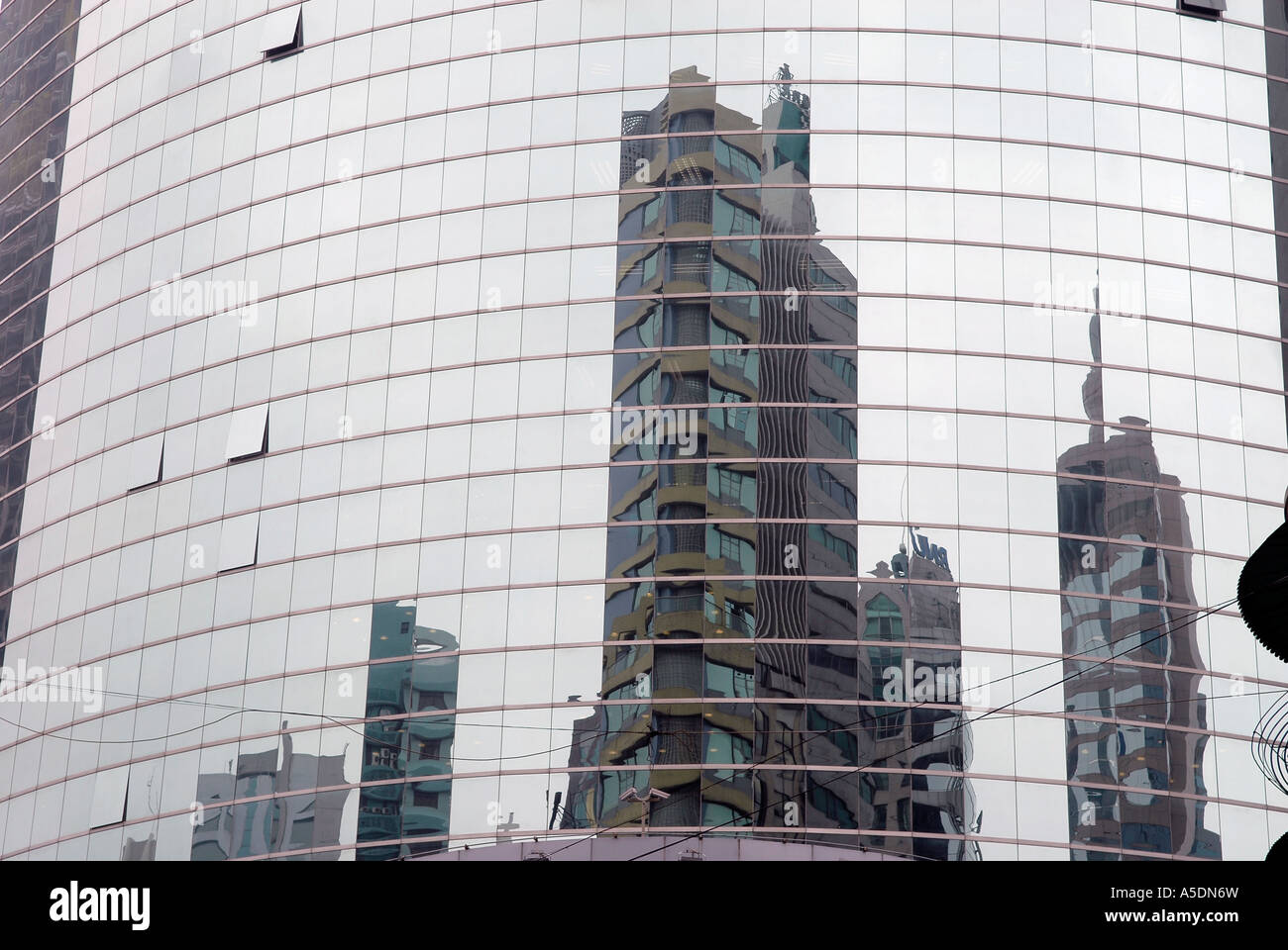 Buildings reflected on a glassed office building in Macau China Stock ...
