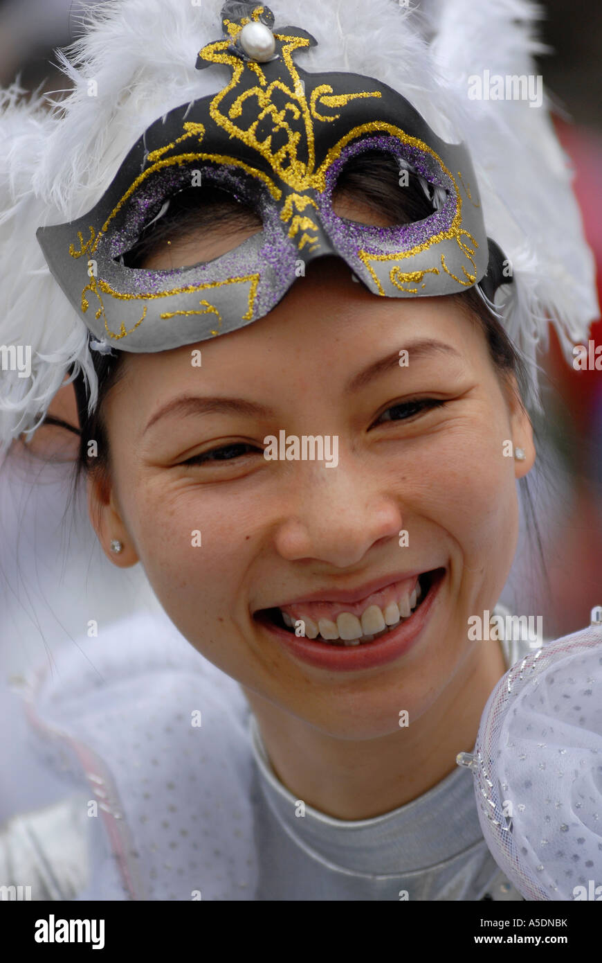 Young Chinese woman wears masquerade mask during Lunar New Year ...