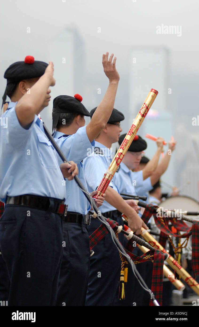 Chinese policeman wearing the traditional Scottish Balmoral hat taking ...