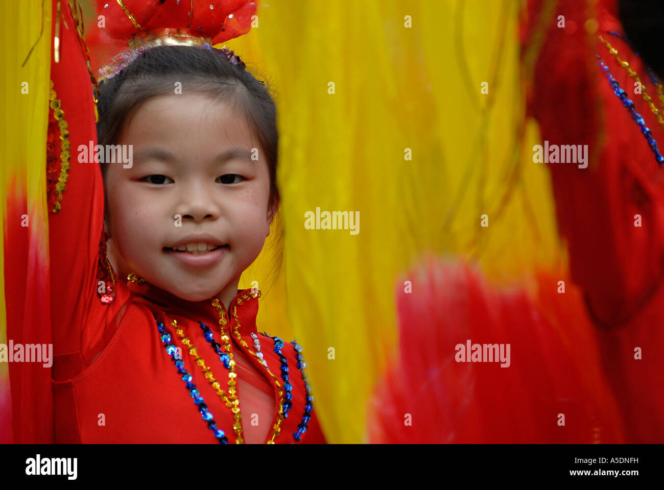 Young Chinese girl in festive outfits smiles as she takes part in the ...