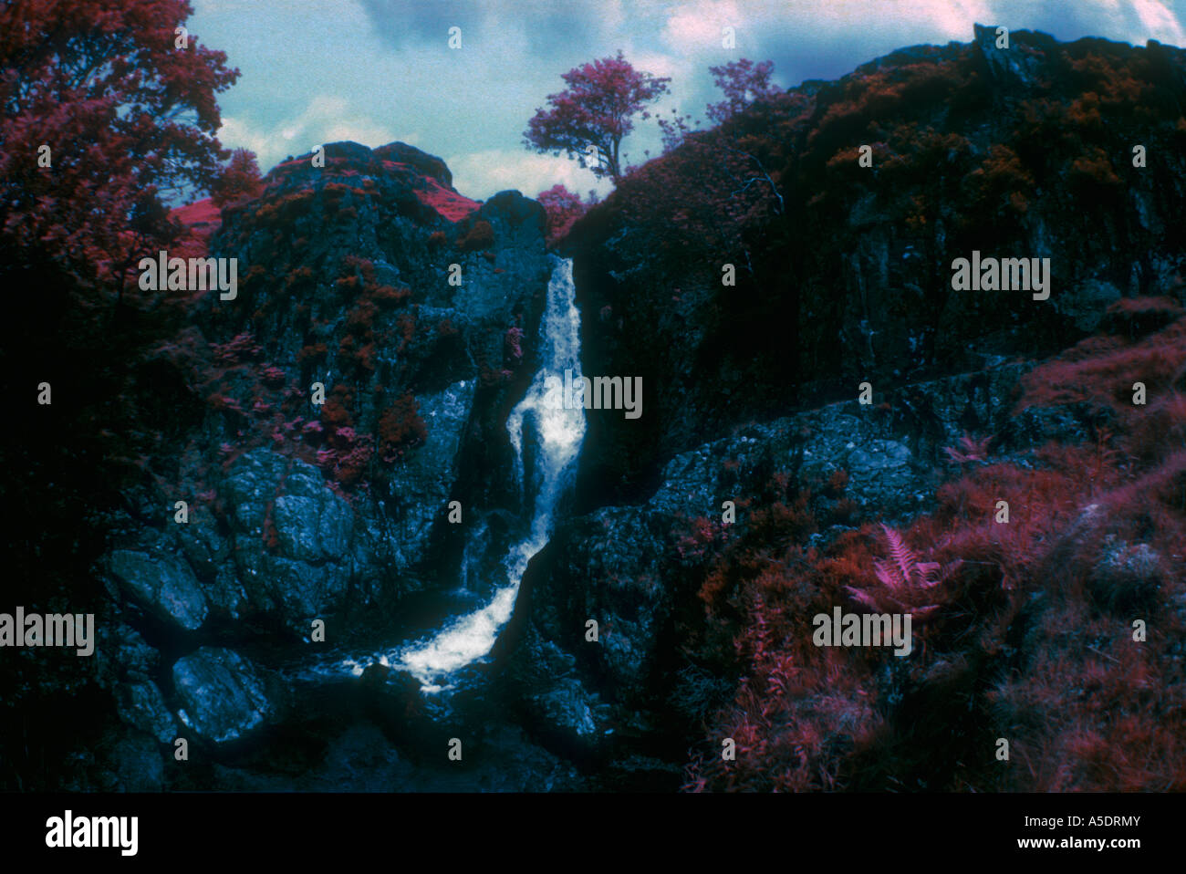 Waterfall in rocky environment Stock Photo - Alamy