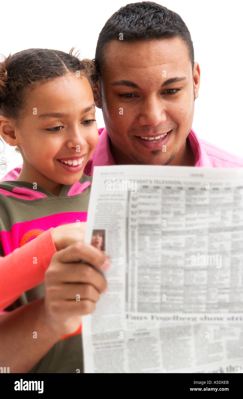 Father and daughter reading newspaper Stock Photo - Alamy