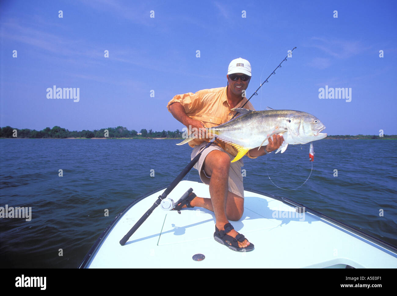 Man holding crevalle jack fish that he has caught Savannah Georgia USA ... Man holding crevalle jack fish that he has caught Savannah Georgia USA ...