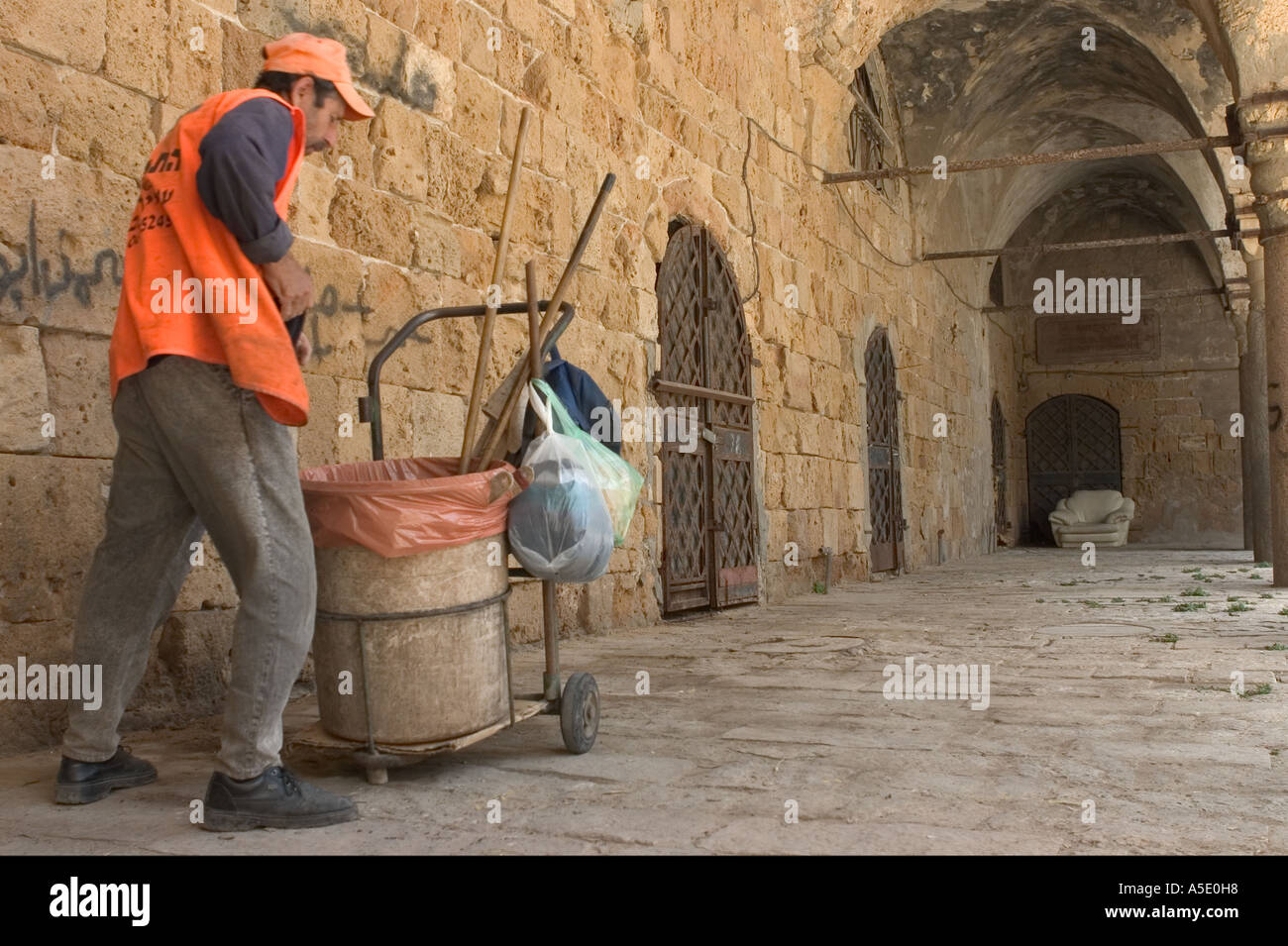 municipal worker cleaning the alley in old Jerusalem Stock Photo - Alamy