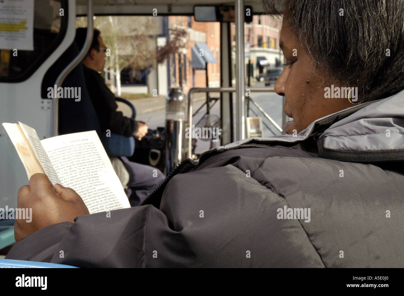 Reading On Bus Stock Photo - Alamy