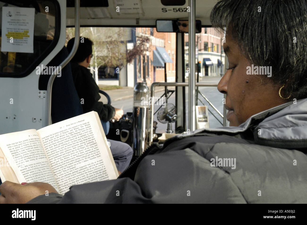 Reading On Bus2 Stock Photo - Alamy
