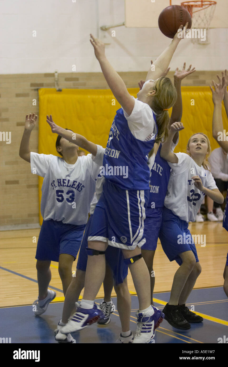 Young girls playing basketball Stock Photo - Alamy