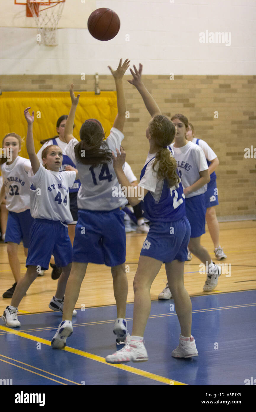 Young girls playing basketball Stock Photo - Alamy