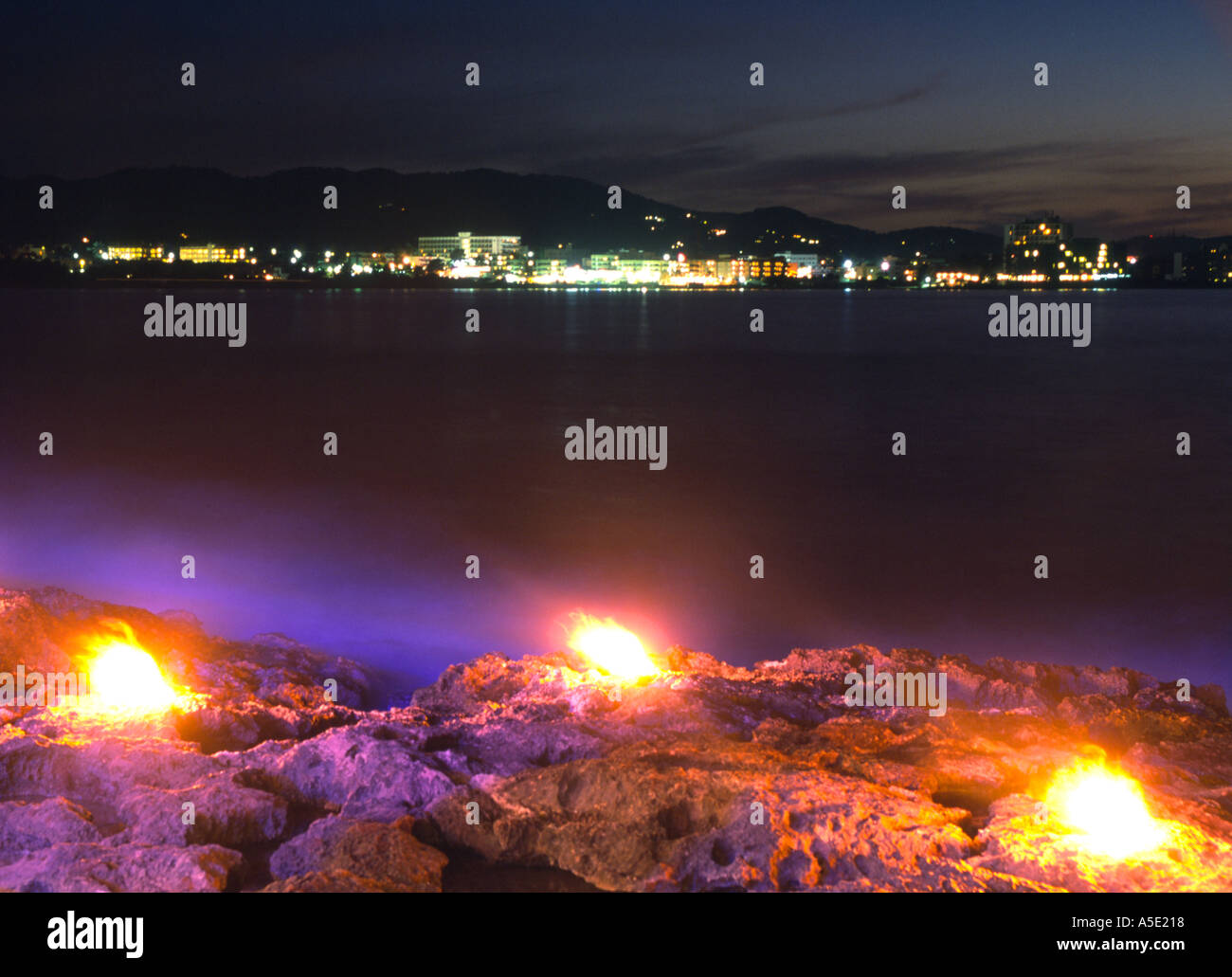 Paraffin burning in rocks Sunset Strip Ibiza Spain Stock Photo - Alamy
