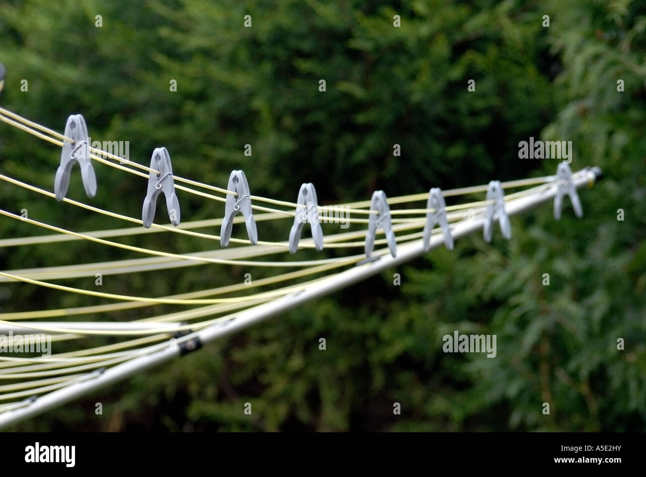 Pegs hanging on an Empty Washing Line Stock Photo - Alamy