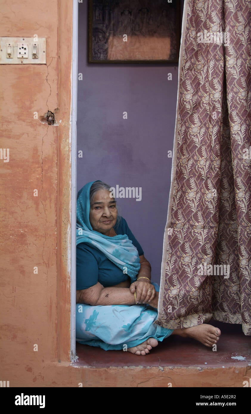 Portrait of a Rajasthani woman in Jaipur, India sitting at her front ...