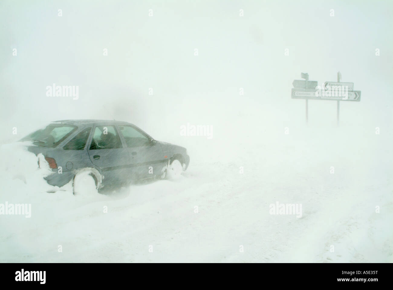 Car stuck in snow during a blizzard on Blakey ridge on the North ...