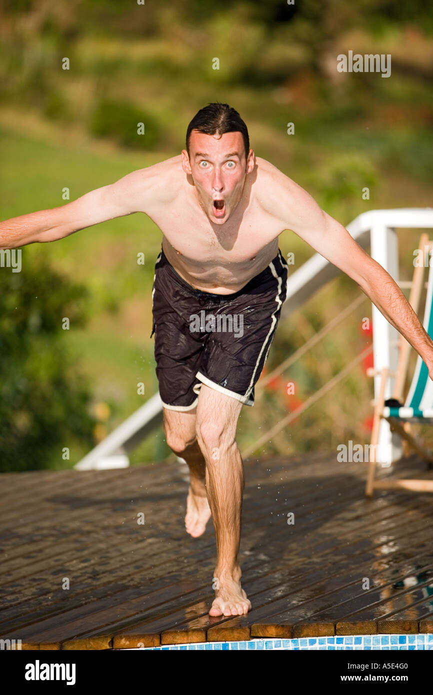 Man Jumping into Swimming Pool Stock Photo - Alamy