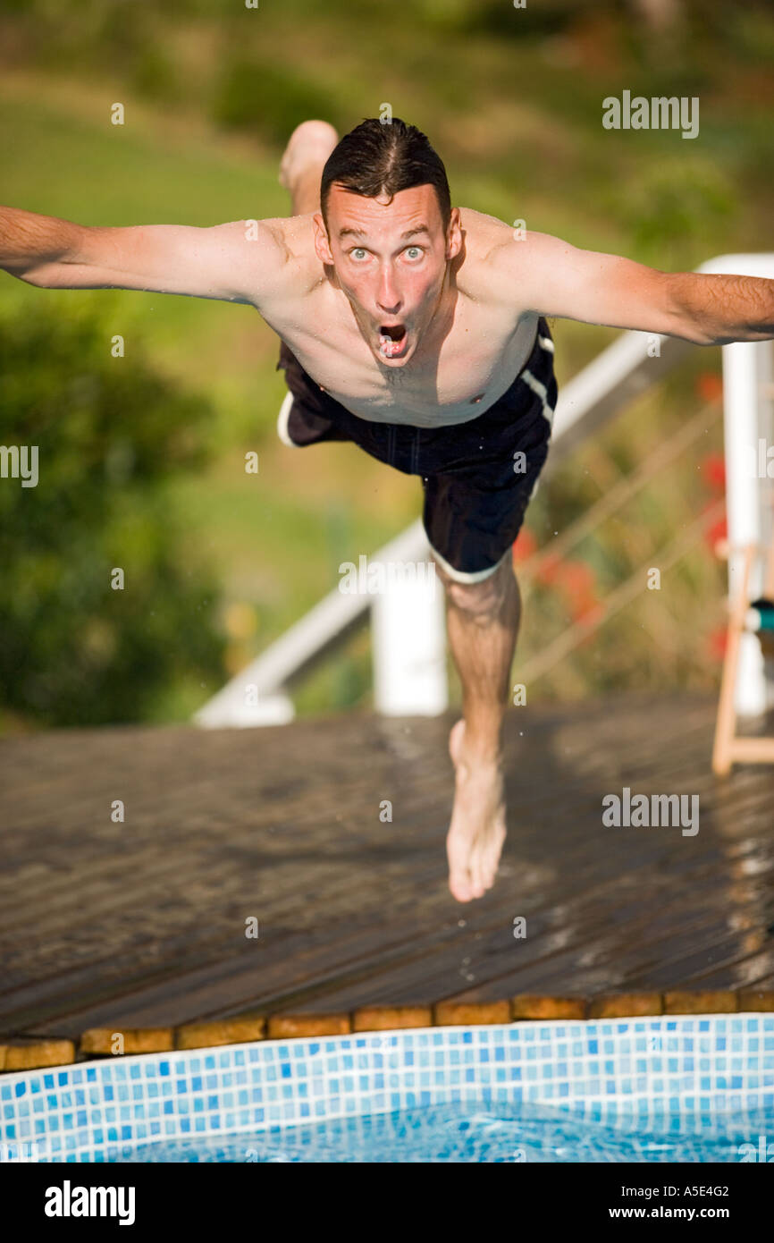 Man Jumping into Swimming Pool Stock Photo - Alamy