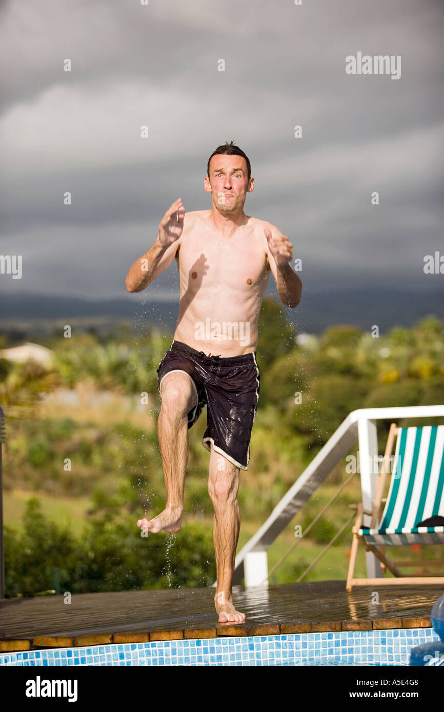 Man Jumping into Swimming Pool Stock Photo - Alamy