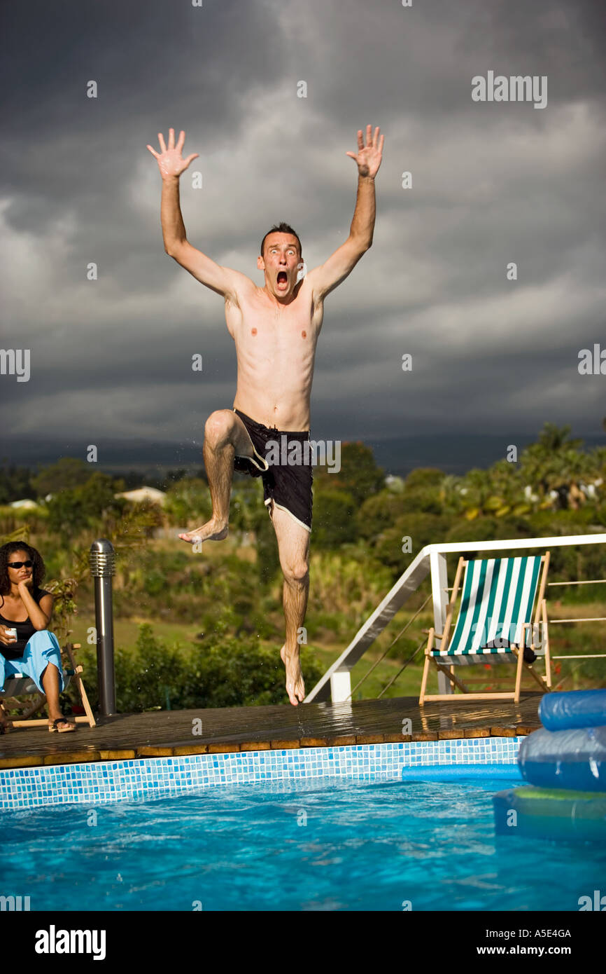 Man Jumping into Swimming Pool Stock Photo - Alamy