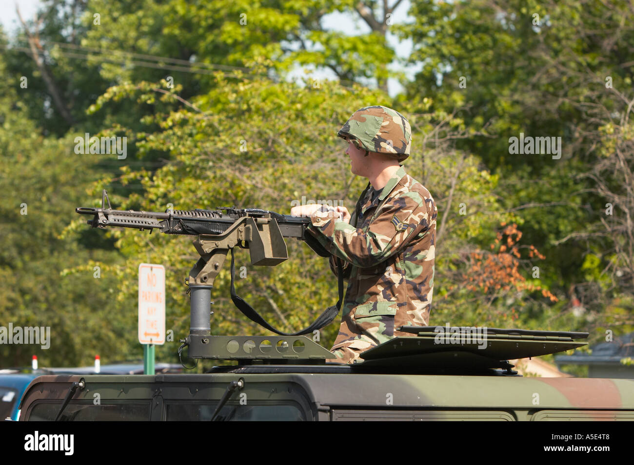 A soldier with a machine gun during a Fourth of July parade Stock Photo ...