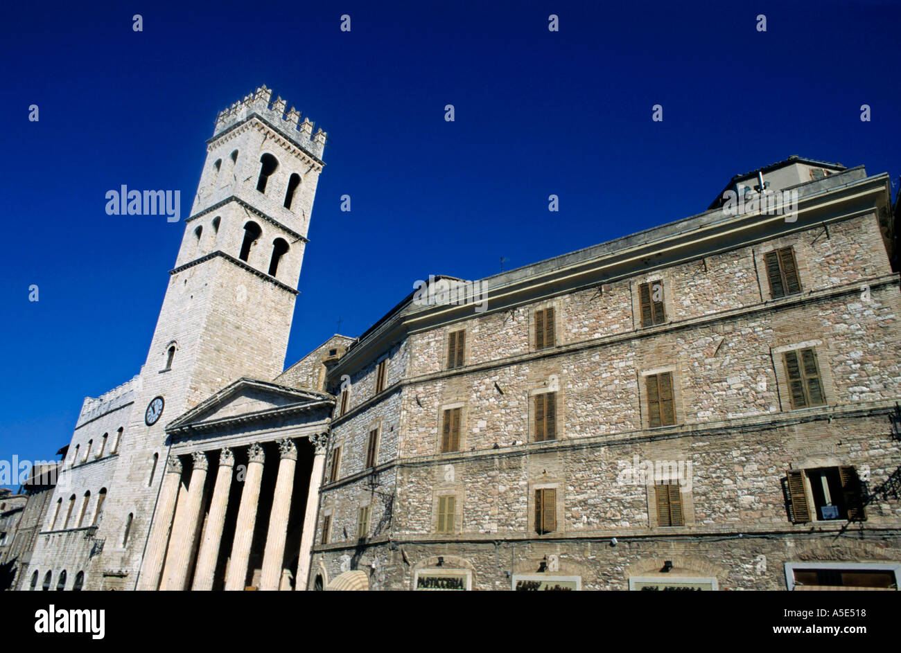 Bell tower and columns of the church once the Temple of Minerva, Assisi ...
