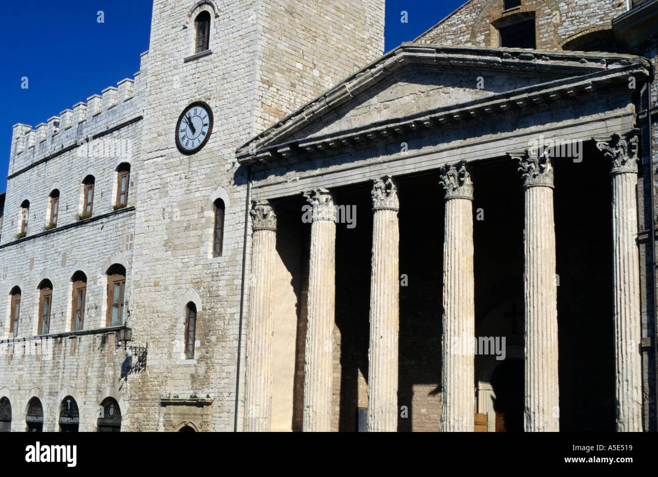 Bell tower and columns of the church once the Temple of Minerva, Assisi ...