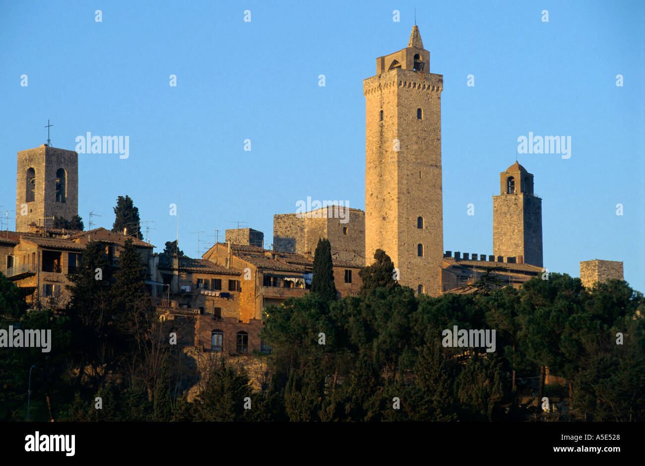 Medieval towers in the townscape at sunset, San Gimignano, Italy Stock ...