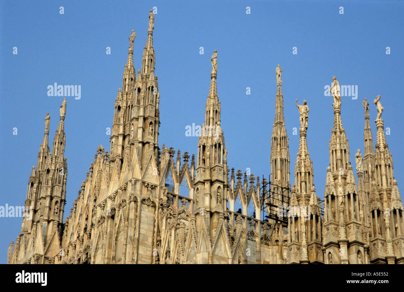 Iconic white pointed Gothic spires of the Milan Cathedral, Milan, Italy ...