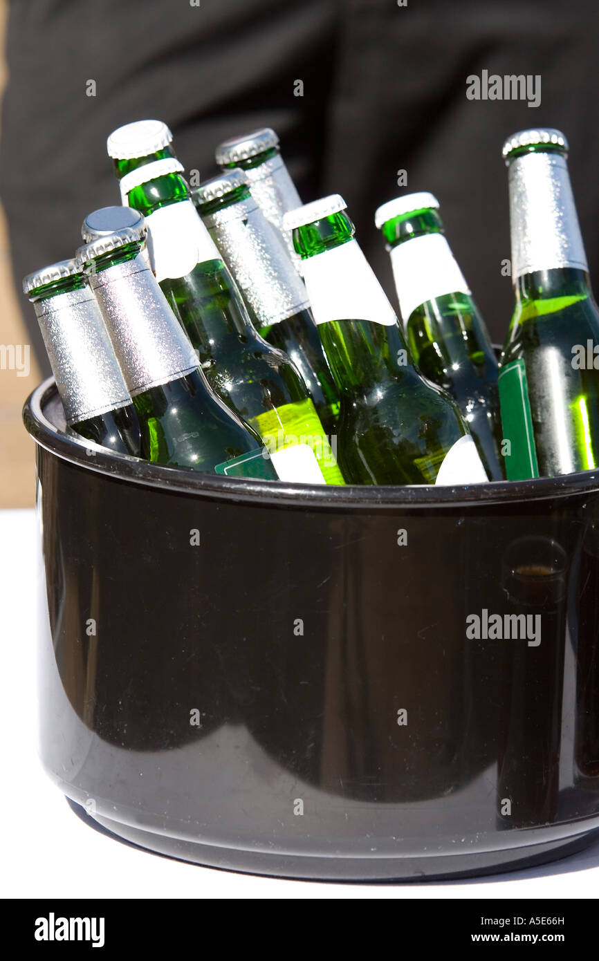 An ice bucket full of bottles of beer Stock Photo - Alamy