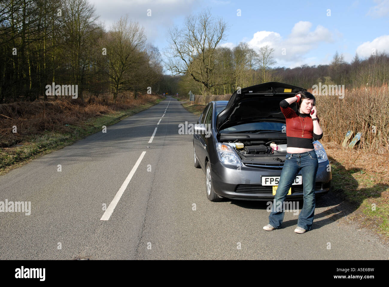 Female with car breakdown Stock Photo - Alamy