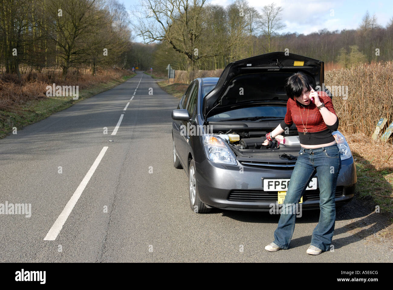 Female Car Breakdown Stock Photo - Alamy