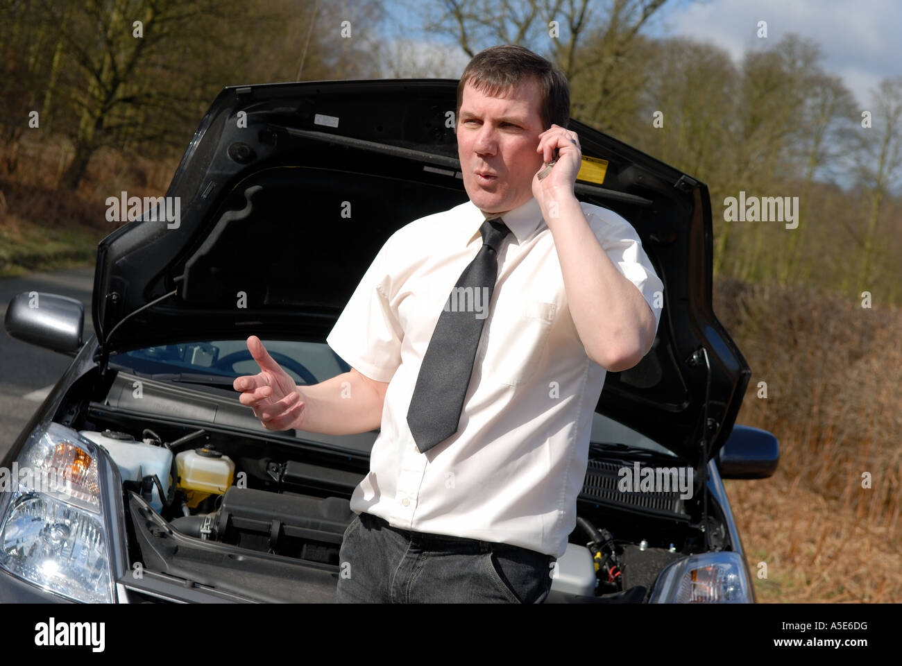 Car Breakdown Male on Mobile Phone Stock Photo - Alamy