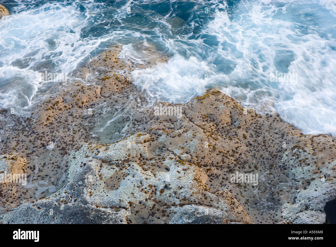 Waves Crashing Against Rock Stock Photo - Alamy