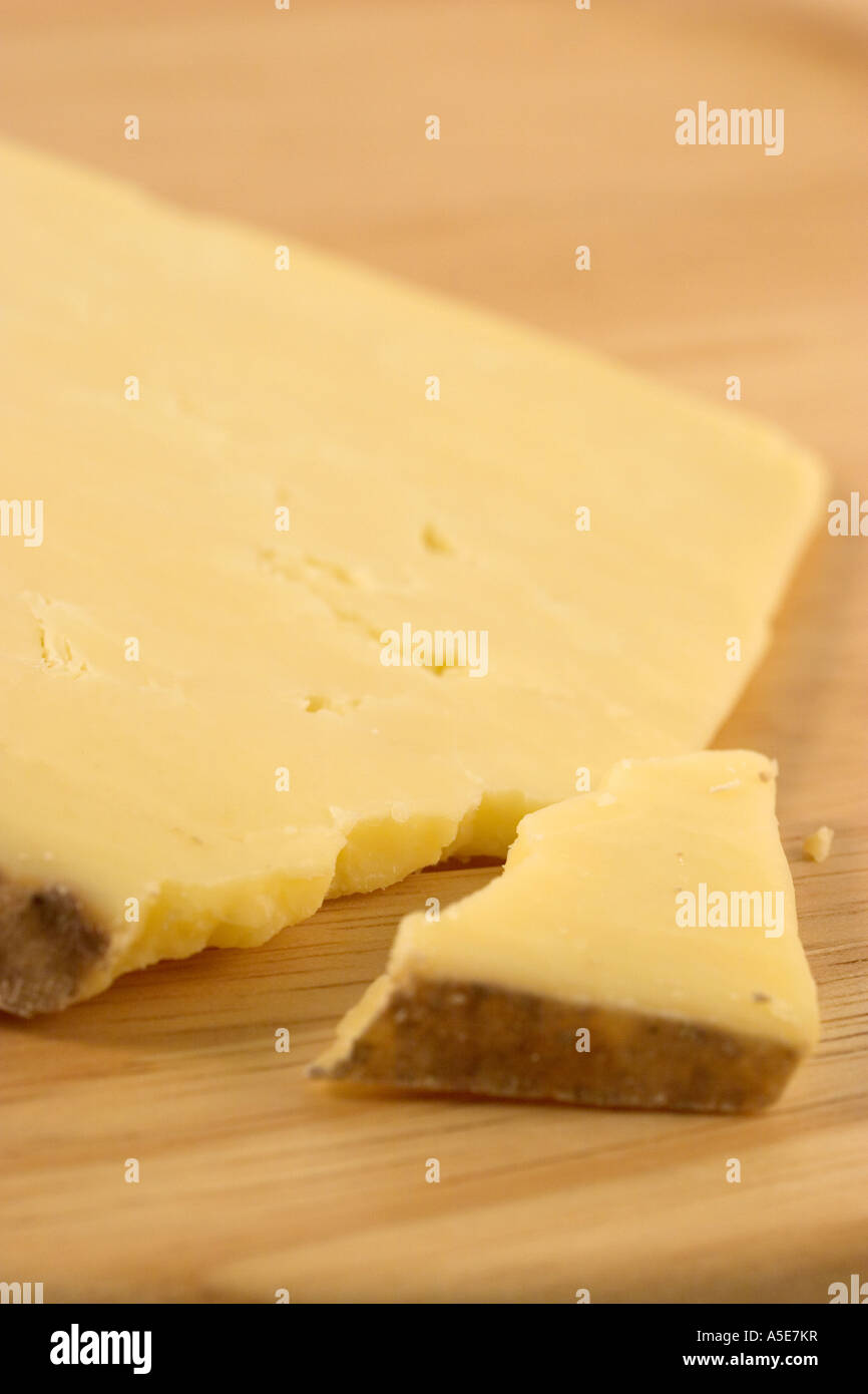 Slice of Mature English Cheddar Cheese Stock Photo - Alamy