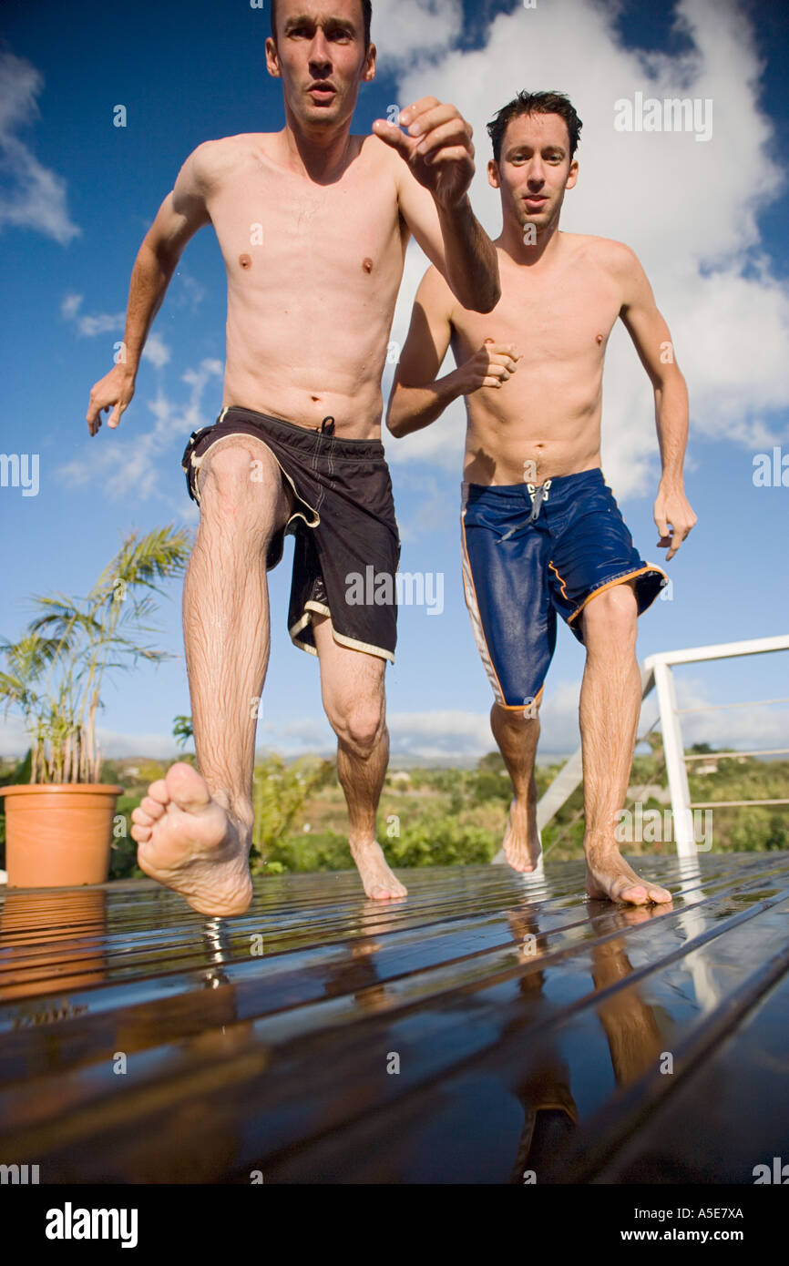 Two men jumping swimming pool hi-res stock photography and images - Alamy