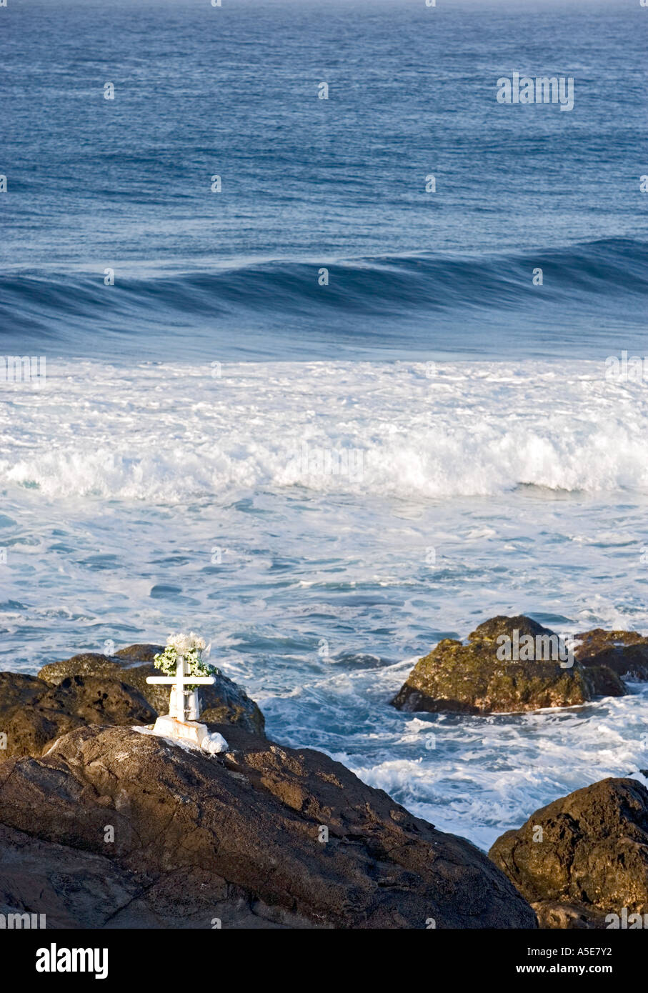 Wave Breaking in the Indian Ocean with a Cross on Coastline Stock Photo ...