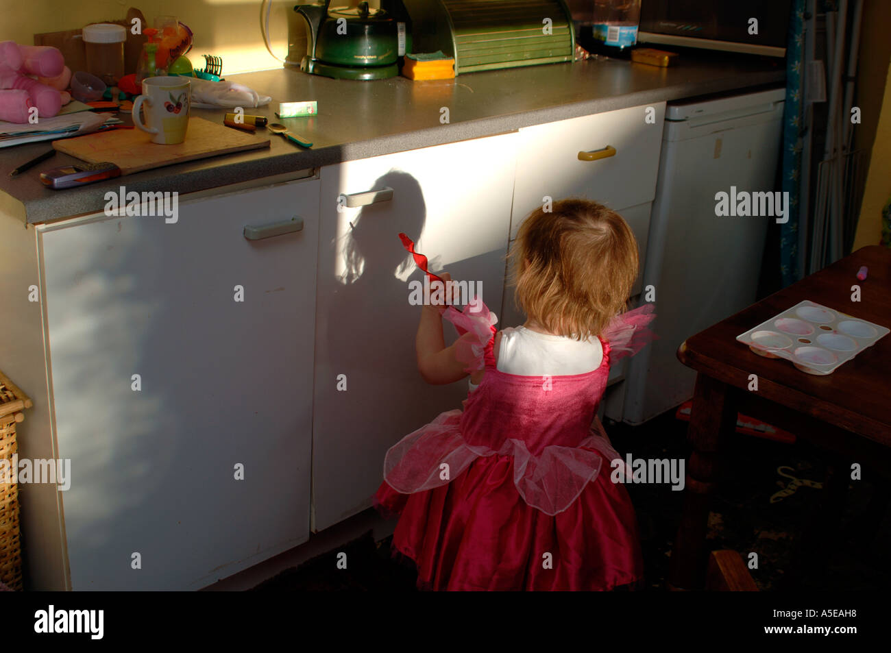 Little Girl Playing With Her Shadow Stock Photo - Alamy