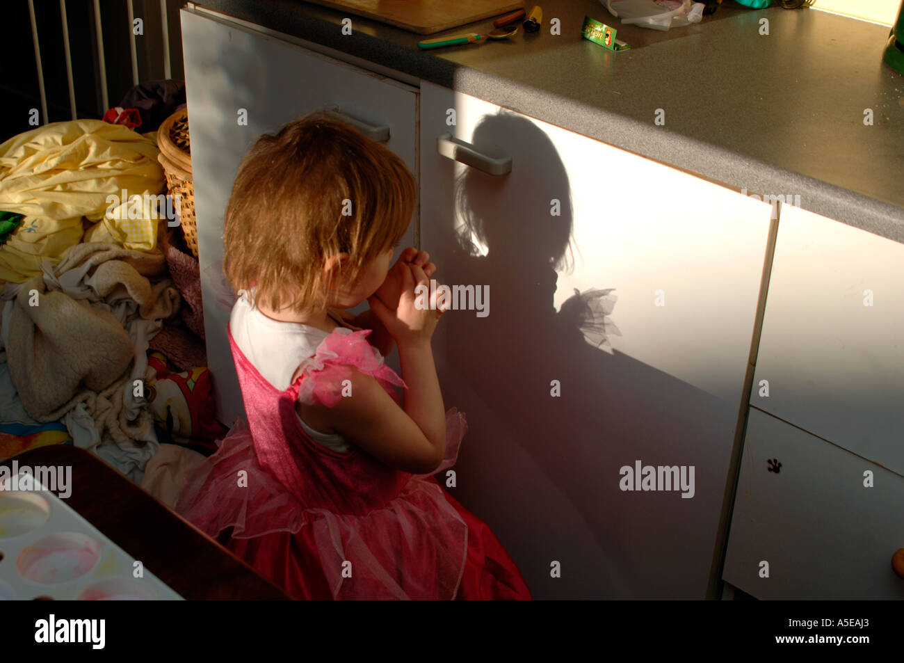 Little Girl Playing With Her Shadow Stock Photo - Alamy
