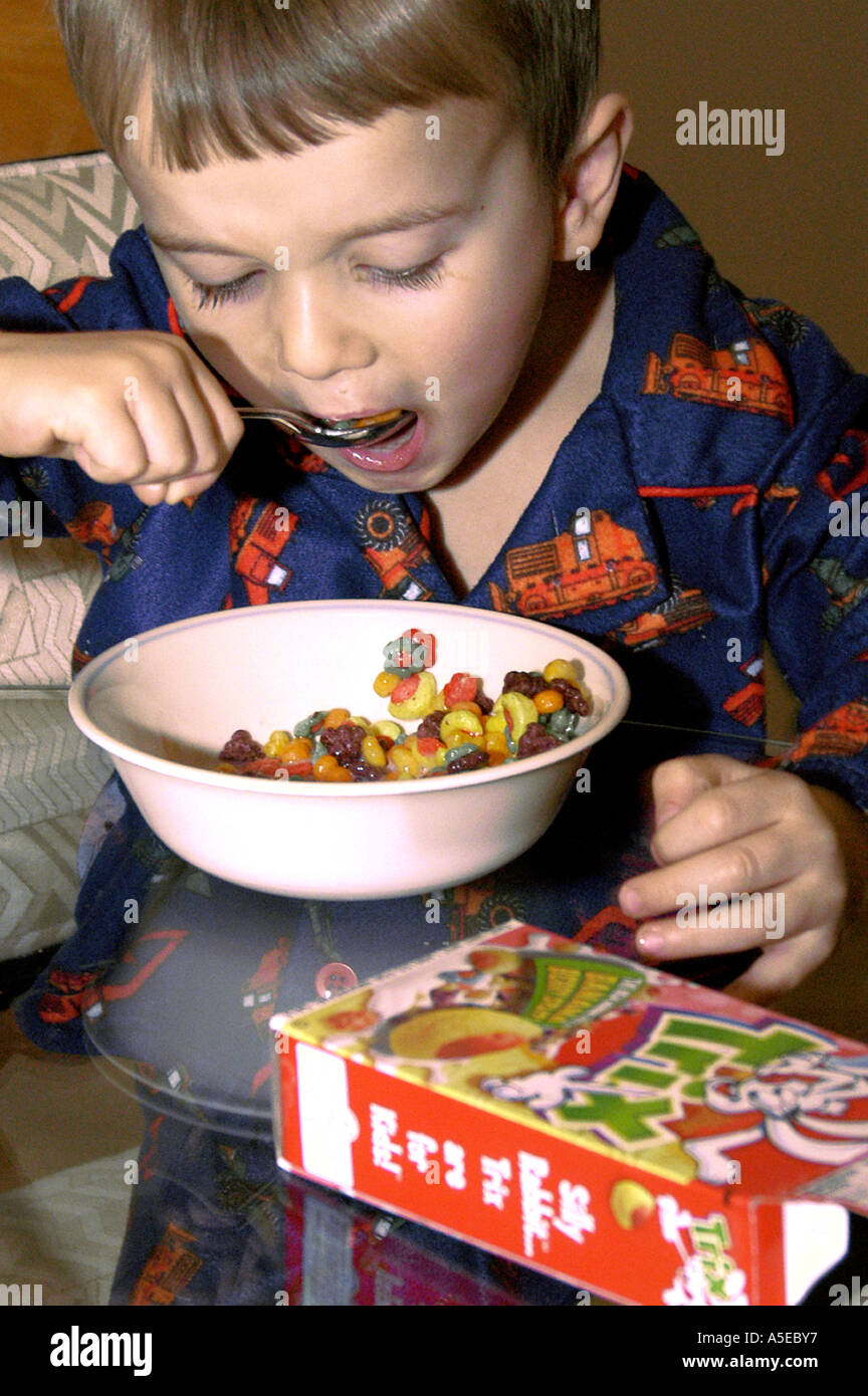 P12 016 3 year Old boy eating Cereal from Individual Serving Box Stock ...