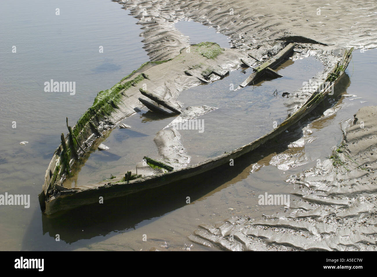 decaying boat hull in low tide Stock Photo - Alamy