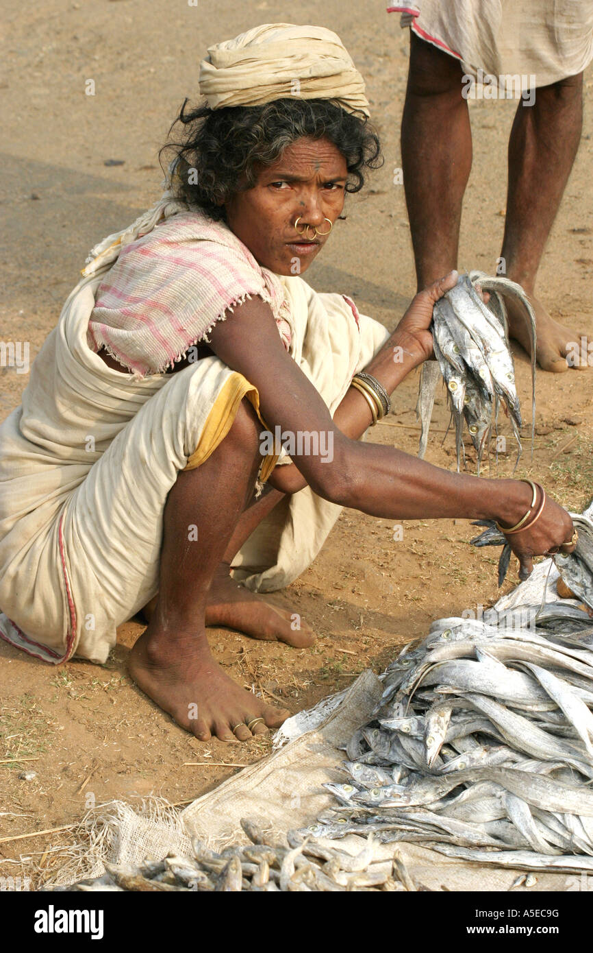 Girl selling fish at a weekly tribal barter market in Orissa ,India ...
