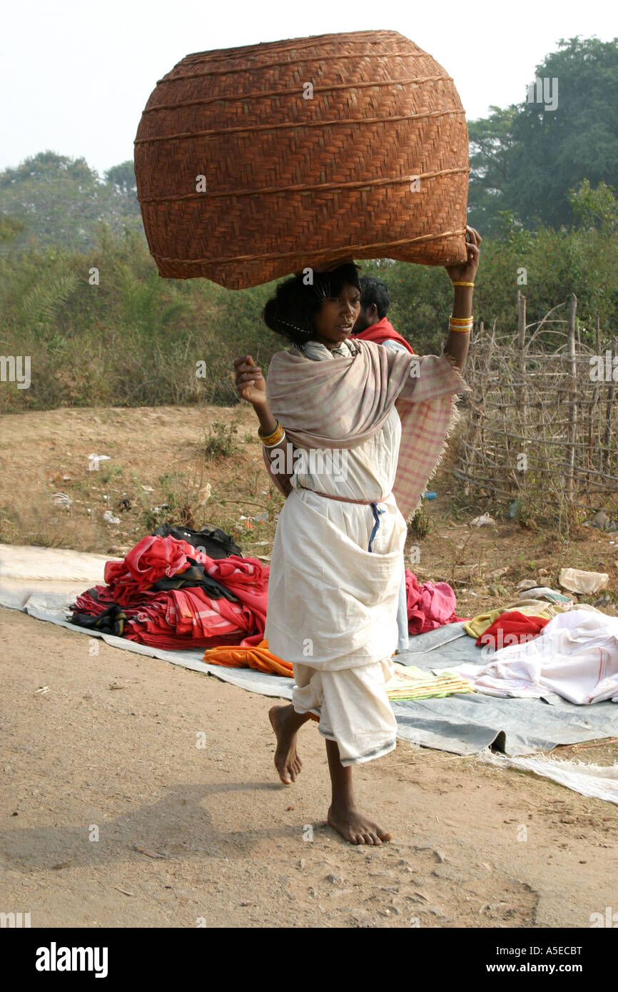 Indigenous woman carries a load on her head hi-res stock photography ...
