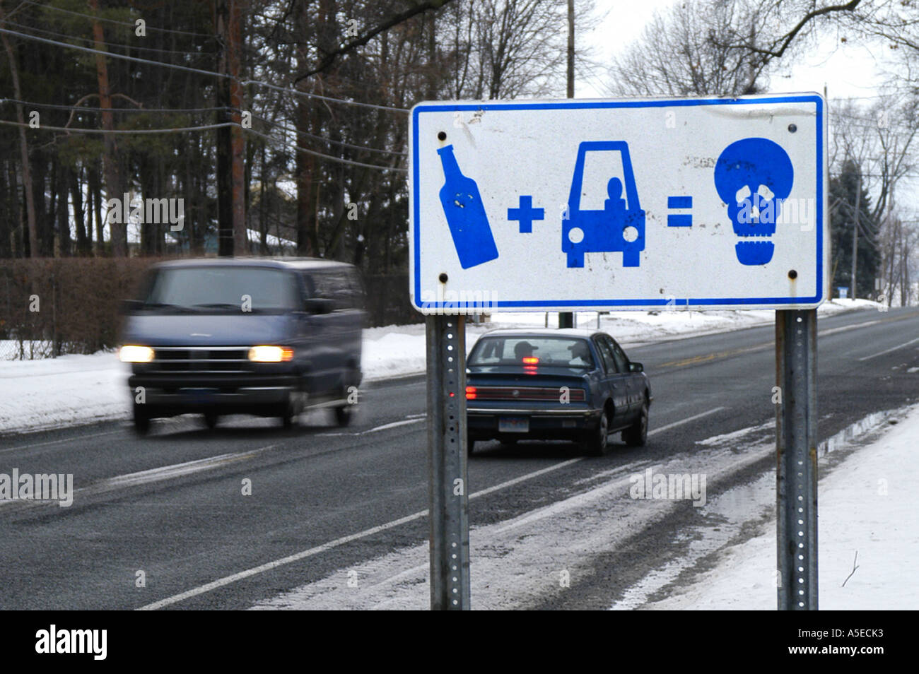 Close horizontal anti drunk driving sign using icons along roadway ...