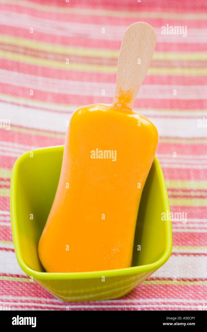 Iced-lolly in green plastic bowl Stock Photo - Alamy