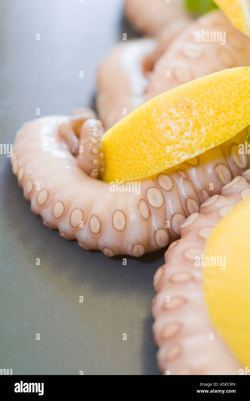 Octopus with lemon Stock Photo - Alamy