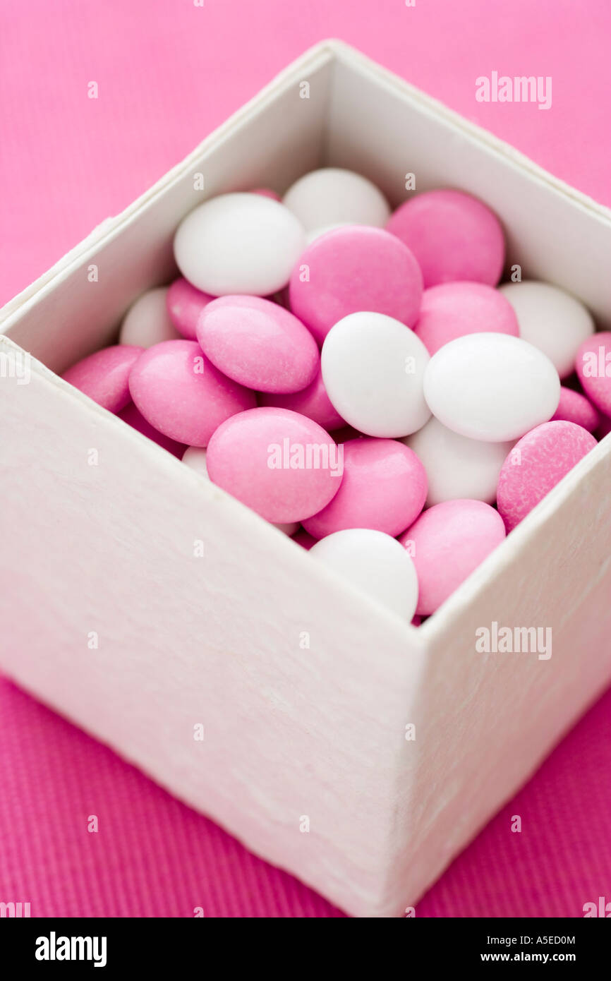 Pink peppermint candies in white box Stock Photo - Alamy