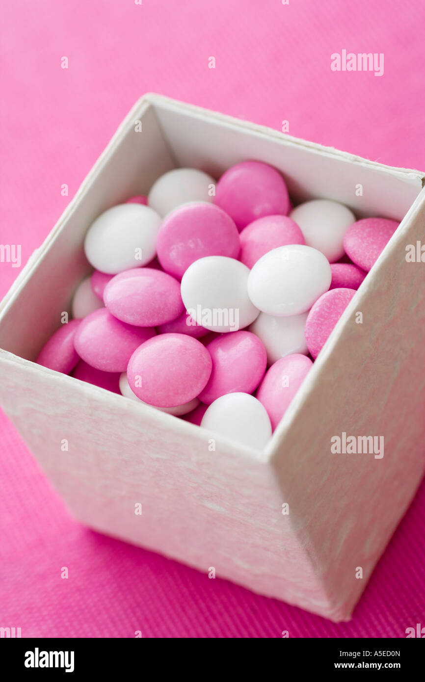 Pink peppermint candies in white box Stock Photo - Alamy