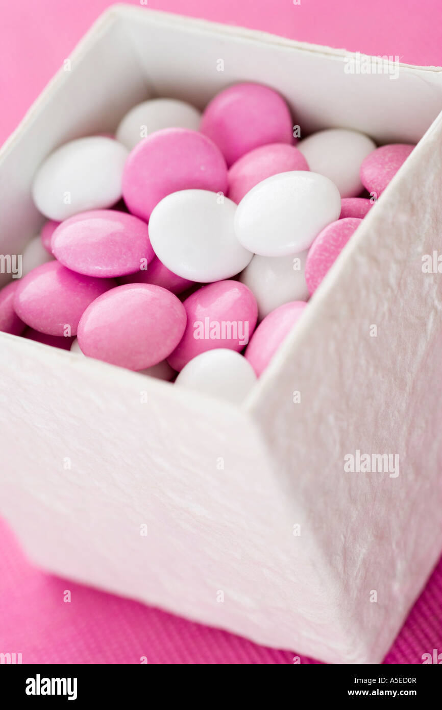 Pink peppermint candies in white box Stock Photo - Alamy