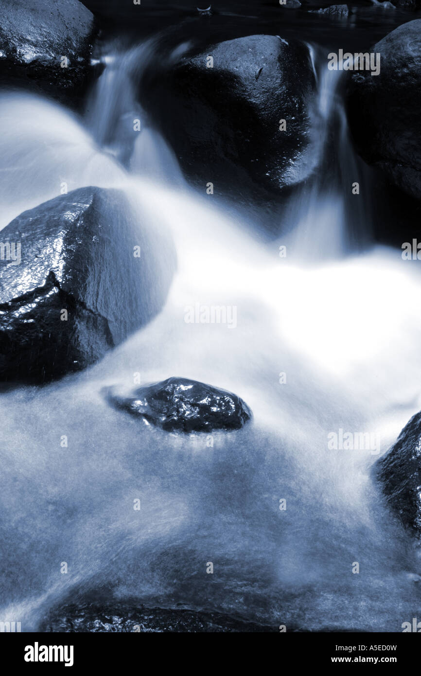 Water flowing through rocks Stock Photo - Alamy