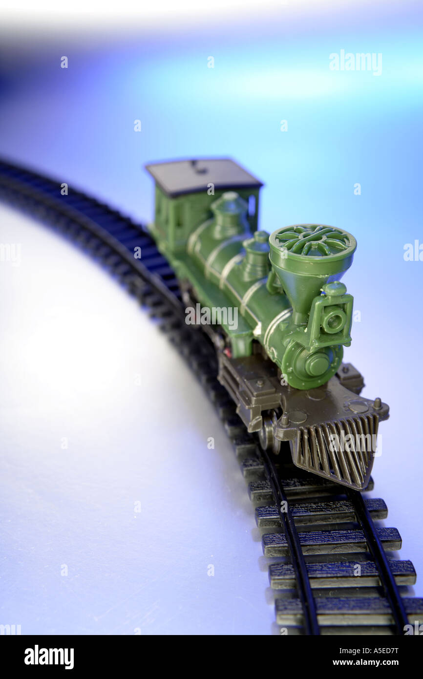 Toy train engine on track Stock Photo - Alamy