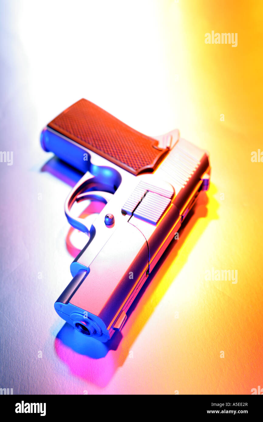 Handgun on colorful background Stock Photo - Alamy