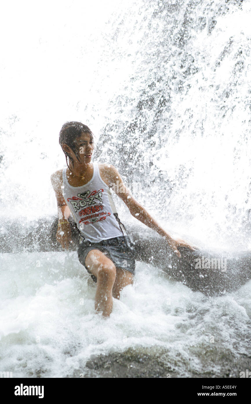 Thailand, thai boy katoey refresh on waterfall at Thale Ban National ...