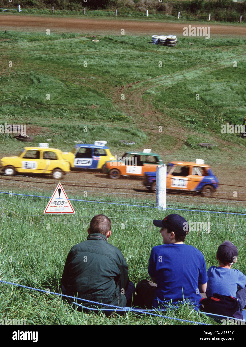 Three boys sat watching dirt track races, Forest of Dean Autograss Club ...